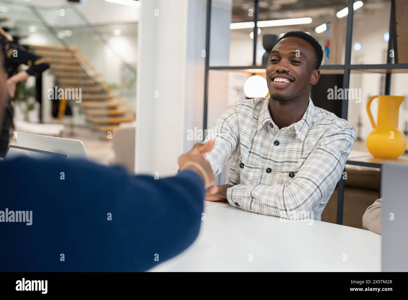 Business people greeting in office Stock Photo - Alamy