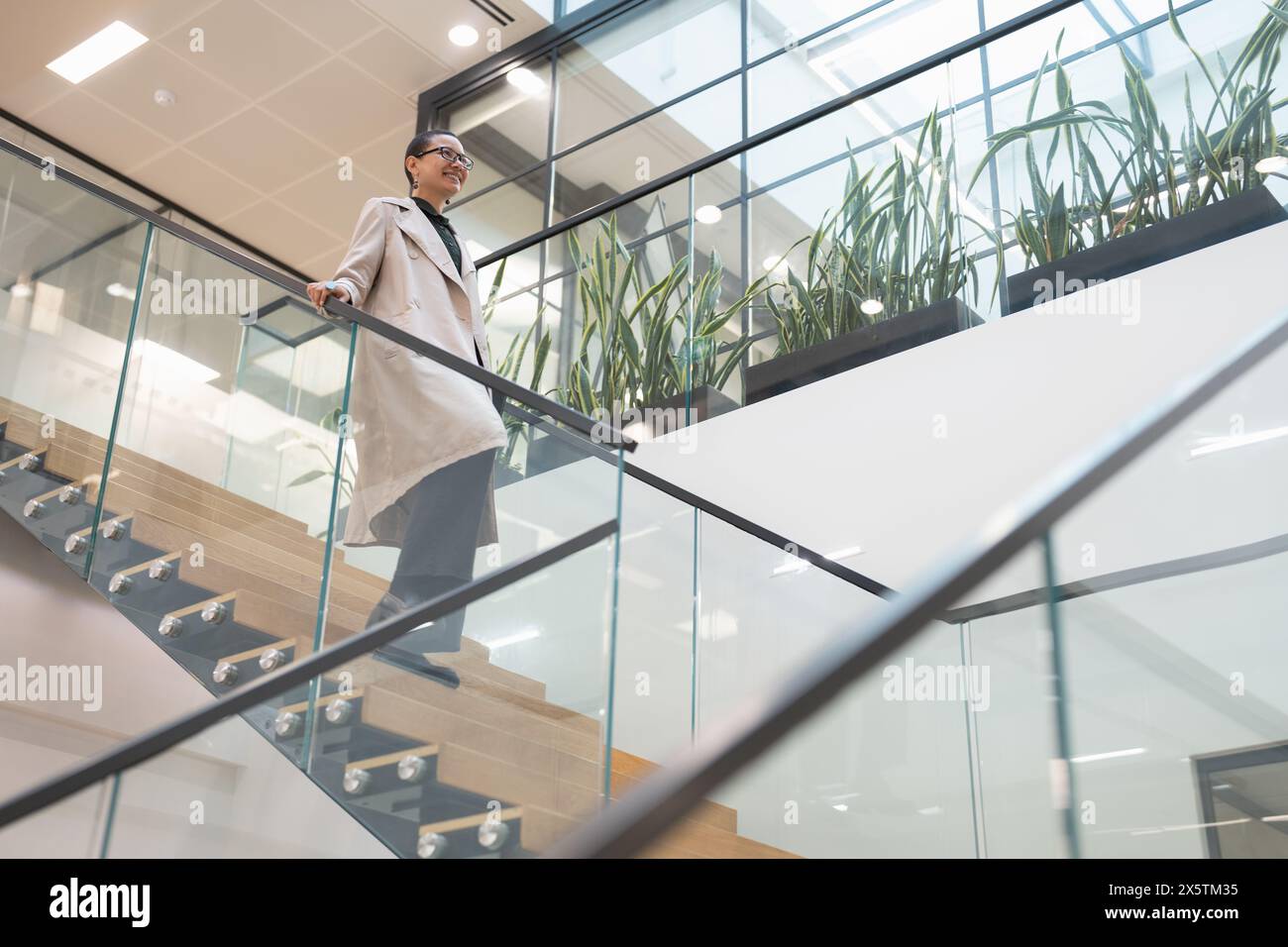 Non binary office worker walking on steps Stock Photo - Alamy Non binary office worker walking on steps Stock Photo - Alamy