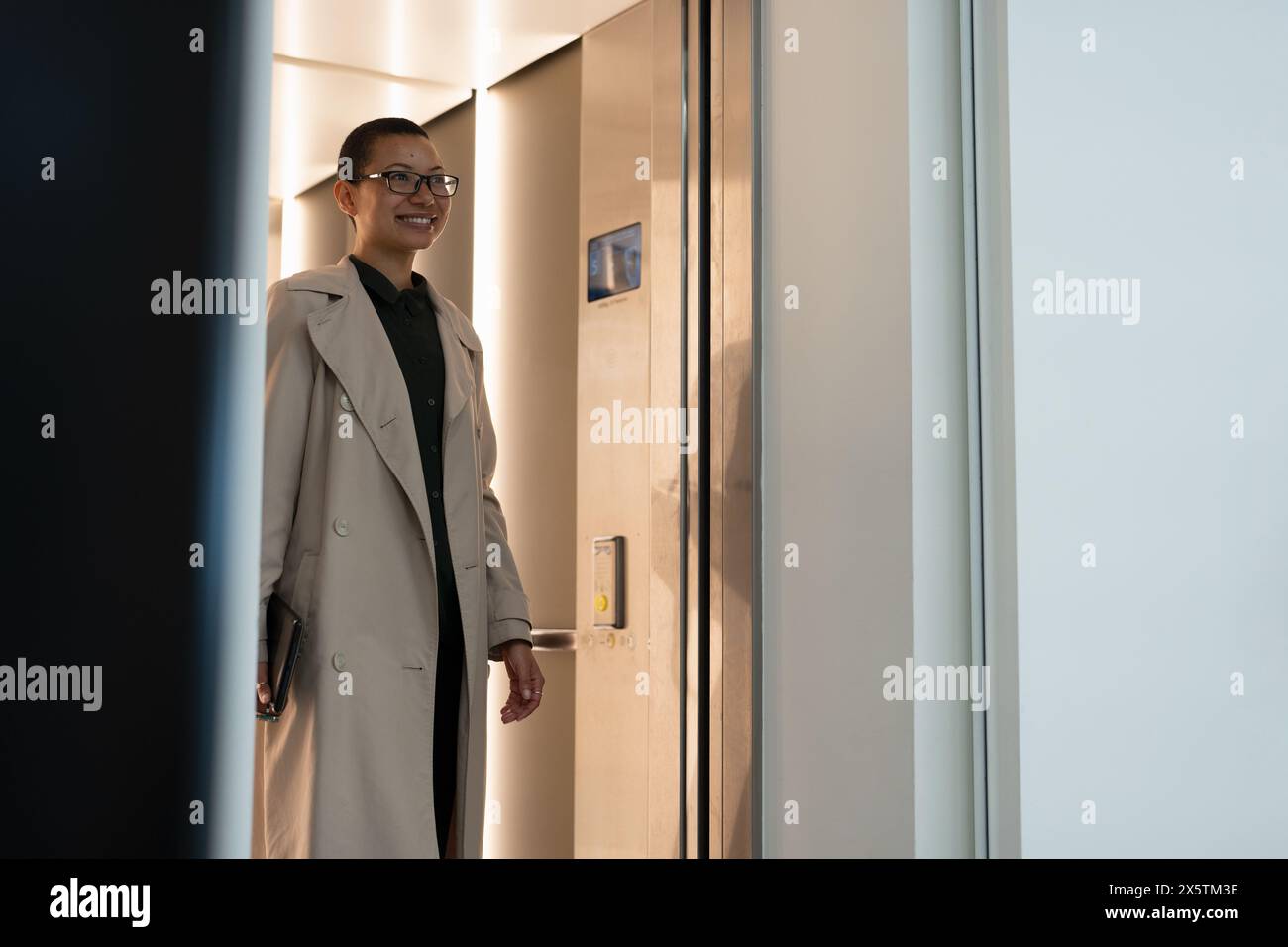 Non binary office worker walking in hallway Stock Photo - Alamy Non binary office worker walking in hallway Stock Photo - Alamy