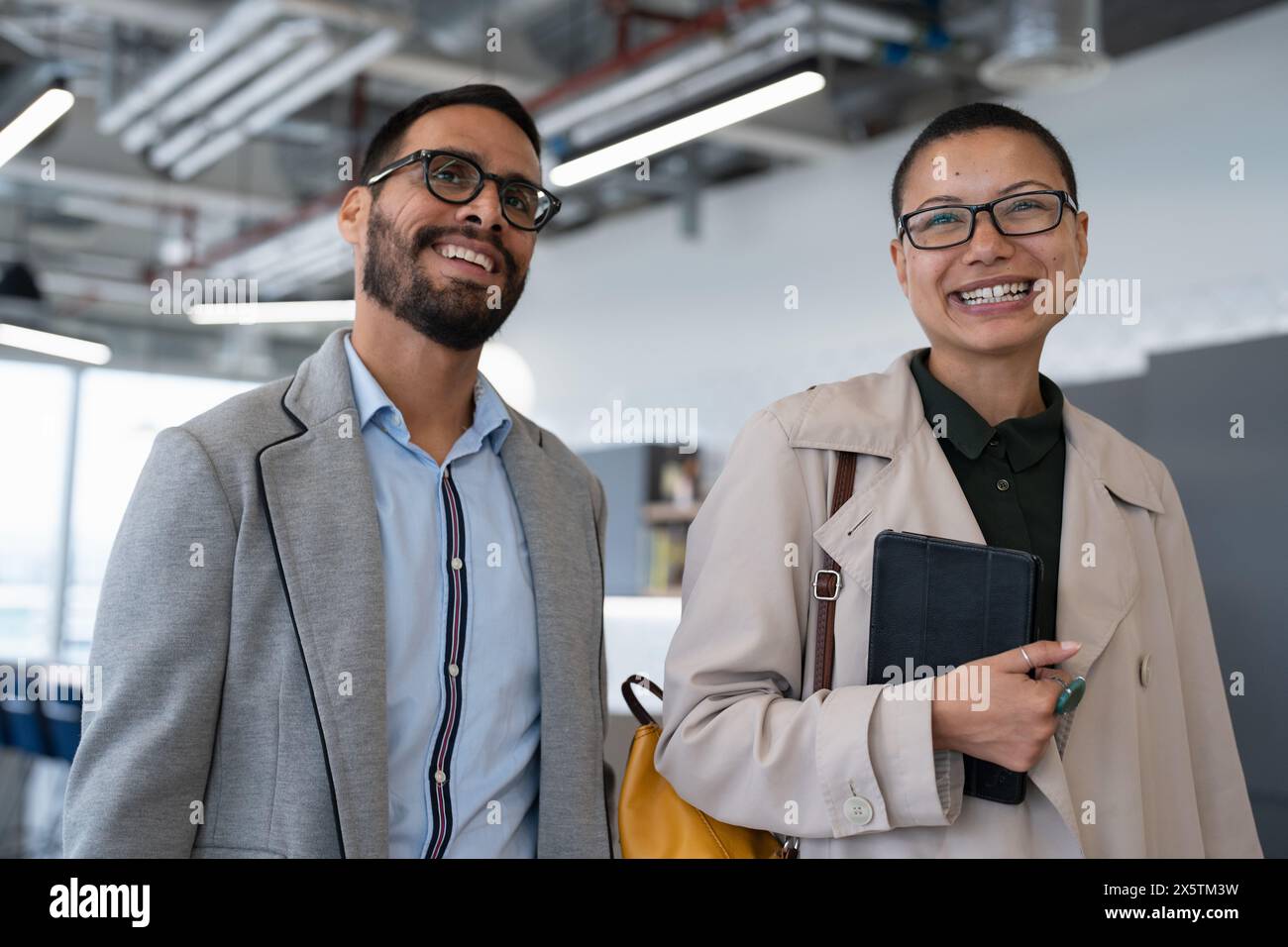 Office workers walking together in hallway Stock Photo - Alamy
