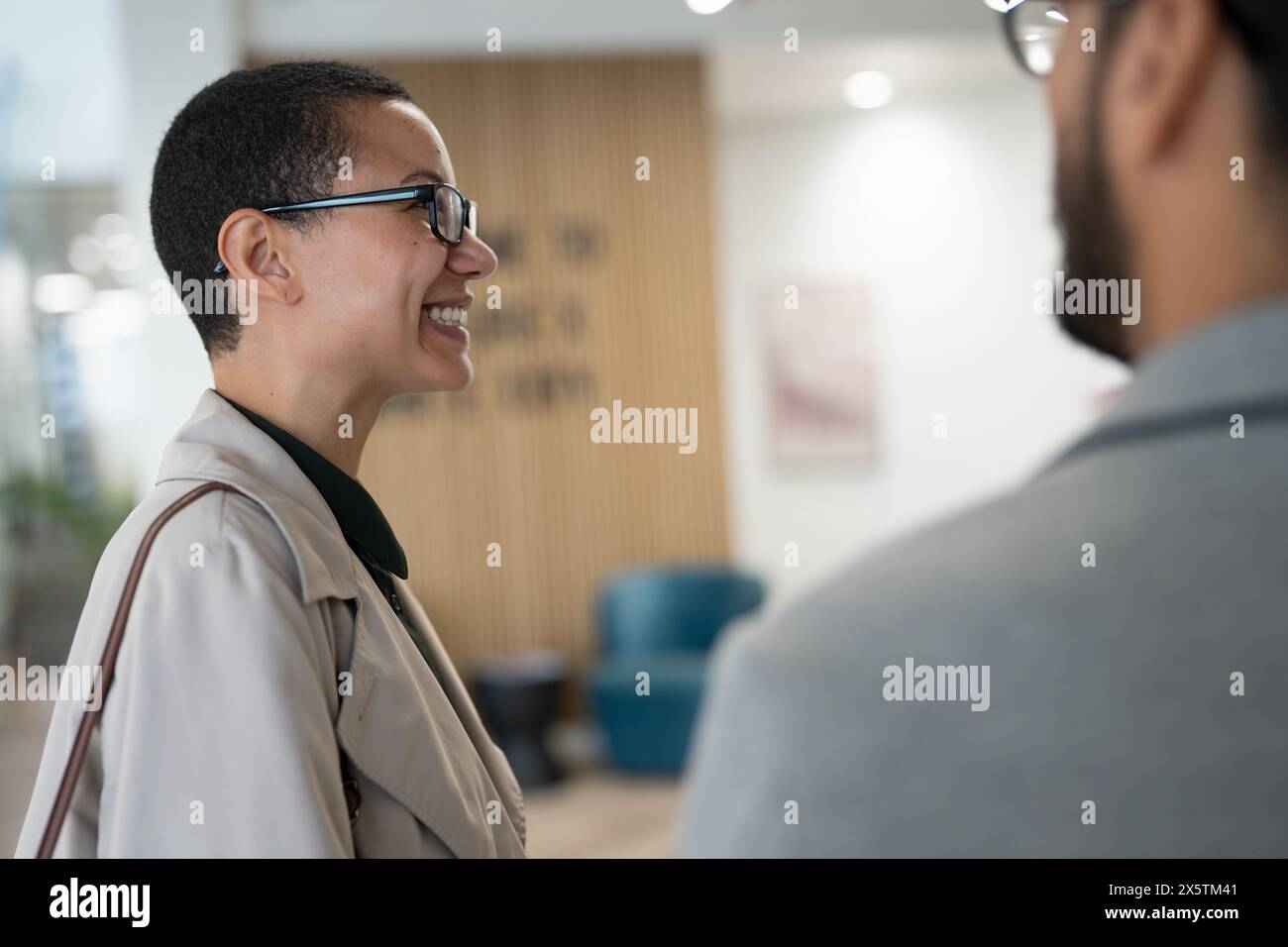 Office workers talking in hallway Stock Photo - Alamy