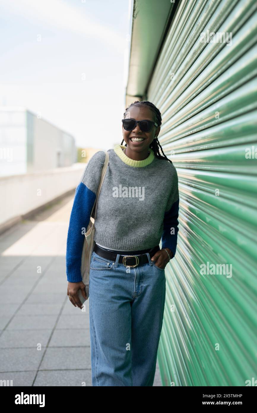 Stylish young woman standing hi-res stock photography and images - Alamy