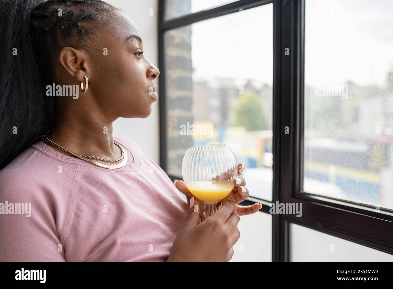 Woman standing window home beautiful woman hi-res stock photography and ...