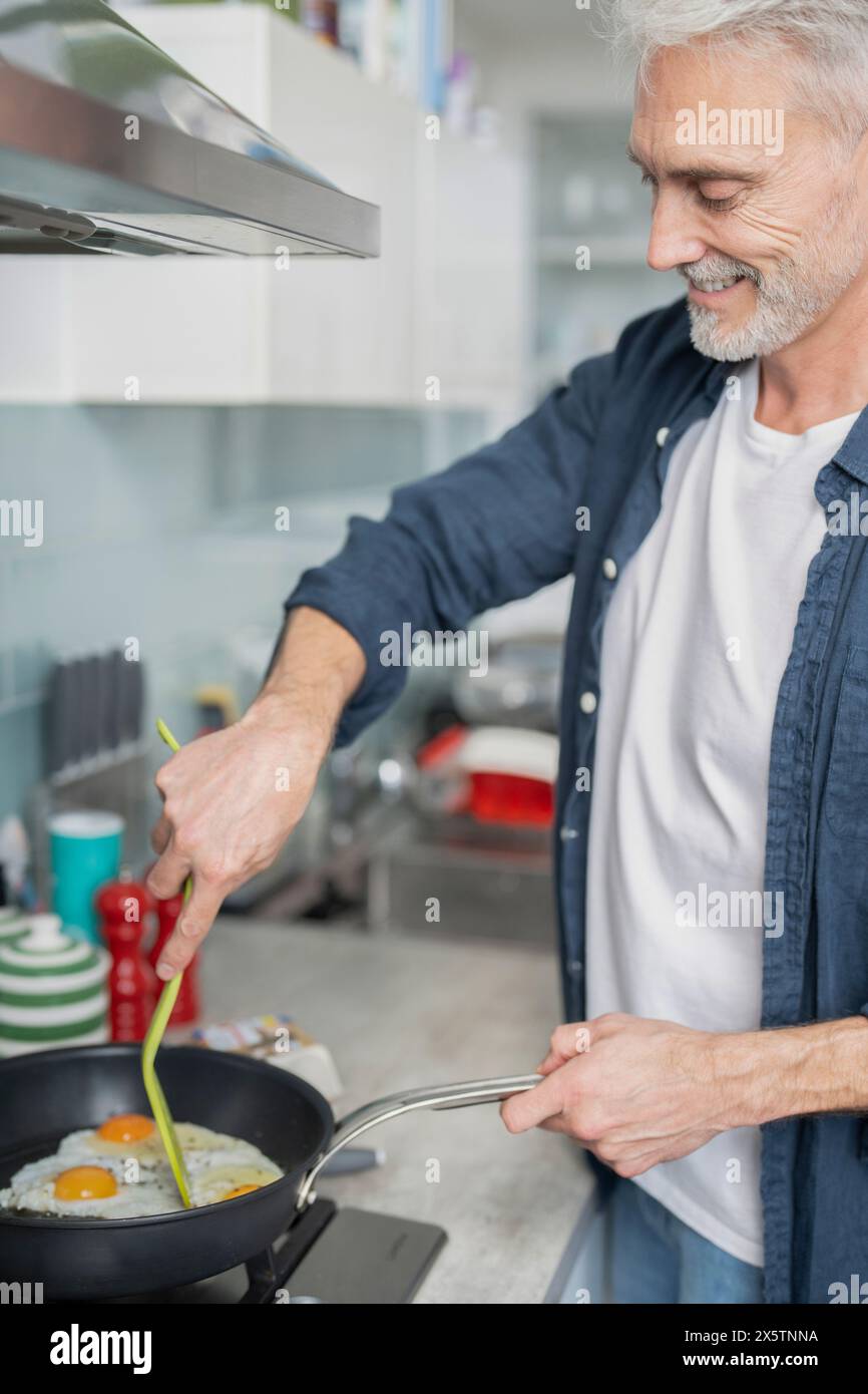 Person cooking eggs hi-res stock photography and images - Alamy