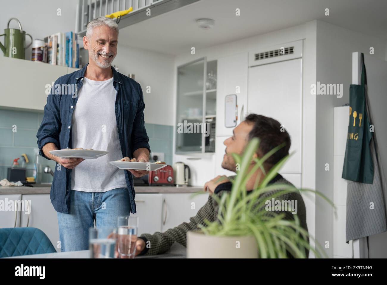 Couple eating breakfast home hi-res stock photography and images - Alamy