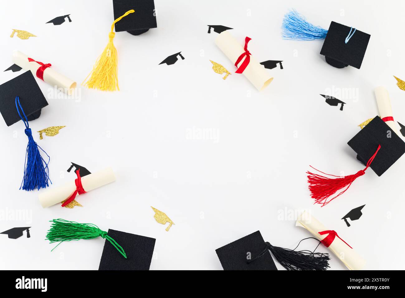 Graduation Celebration Theme. Top view of miniature graduation caps and ...