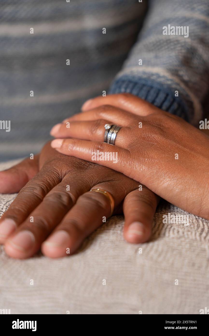 Hand on top of hand hi-res stock photography and images - Alamy