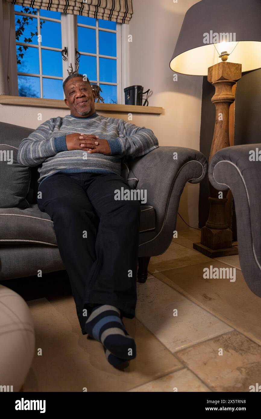 Senior man sitting home on hi-res stock photography and images - Alamy