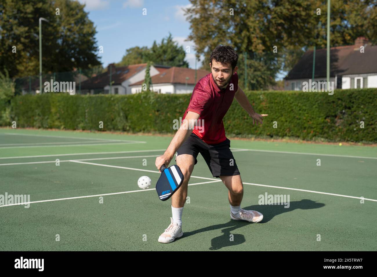 Man playing pickleball Stock Photo - Alamy