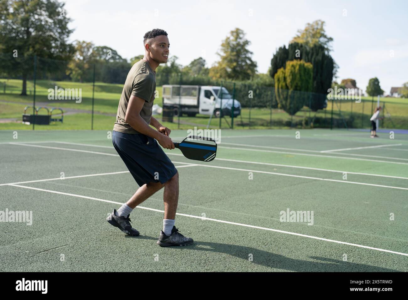 Man playing pickleball Stock Photo - Alamy