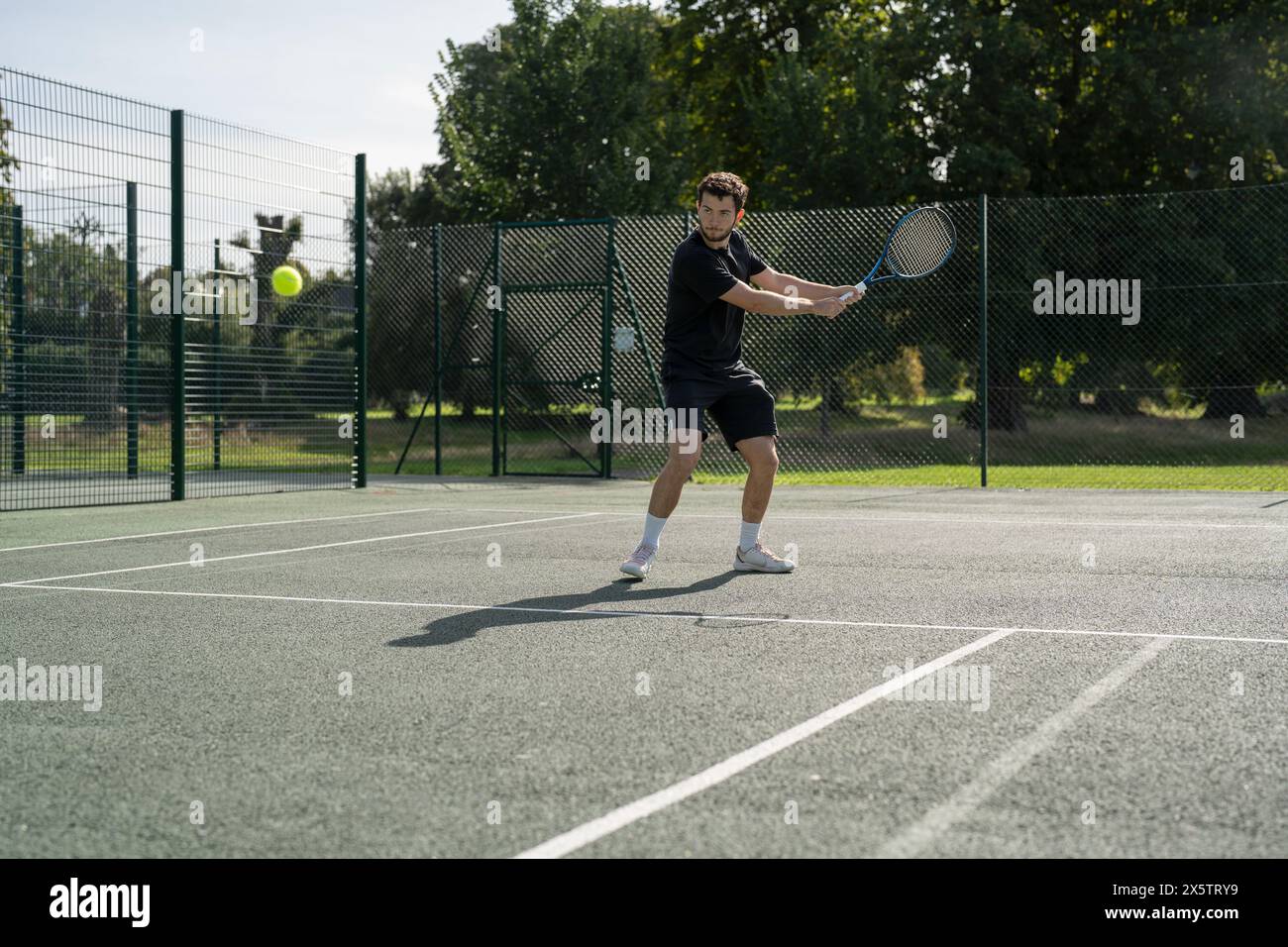 Man playing tennis Stock Photo - Alamy