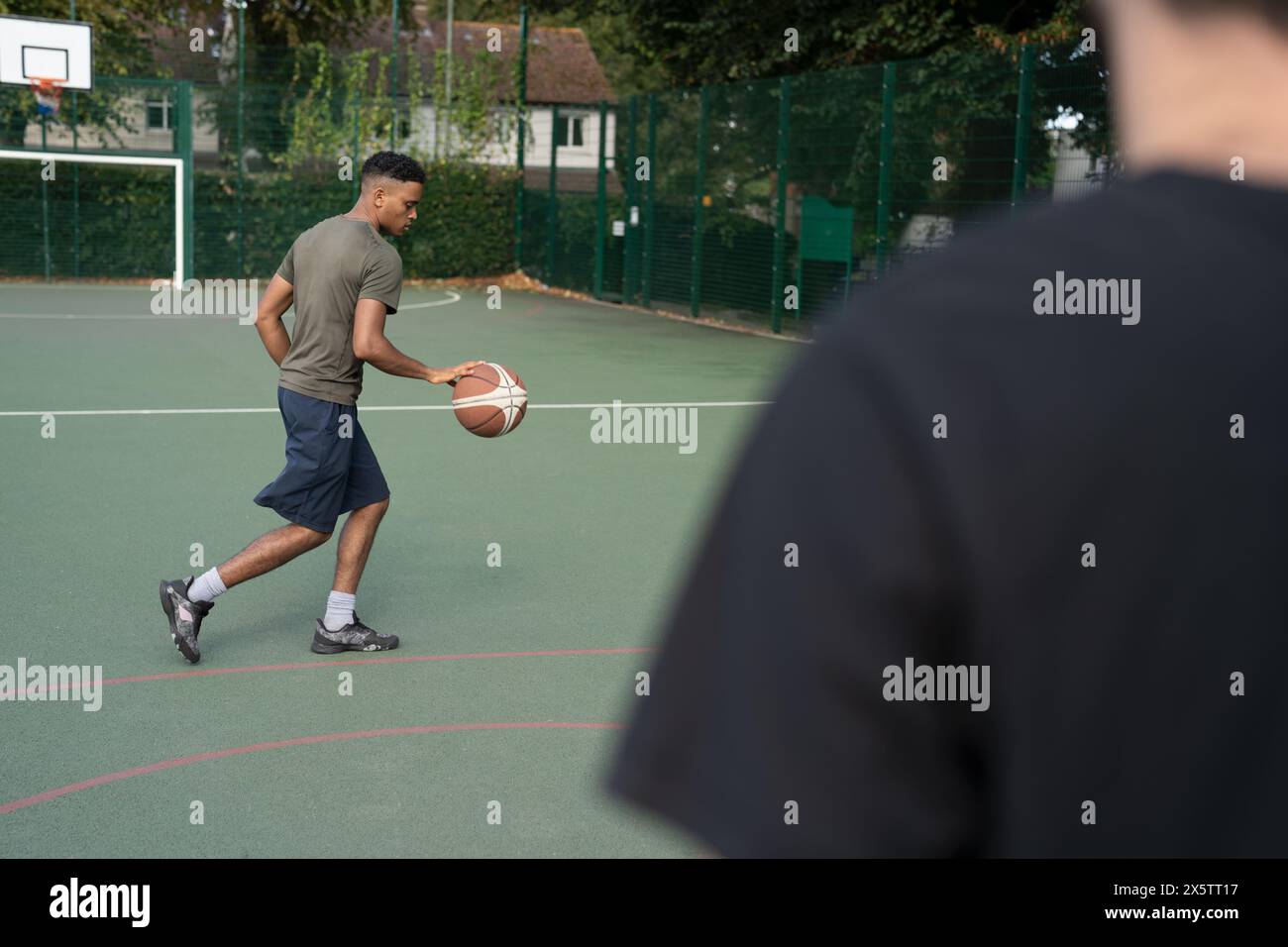 Two men playing outdoor basketball hi-res stock photography and images ...
