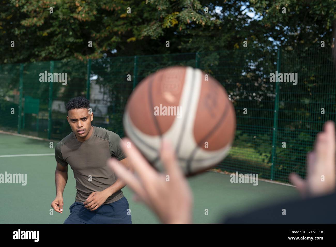 Two men playing outdoor basketball hi-res stock photography and images ...