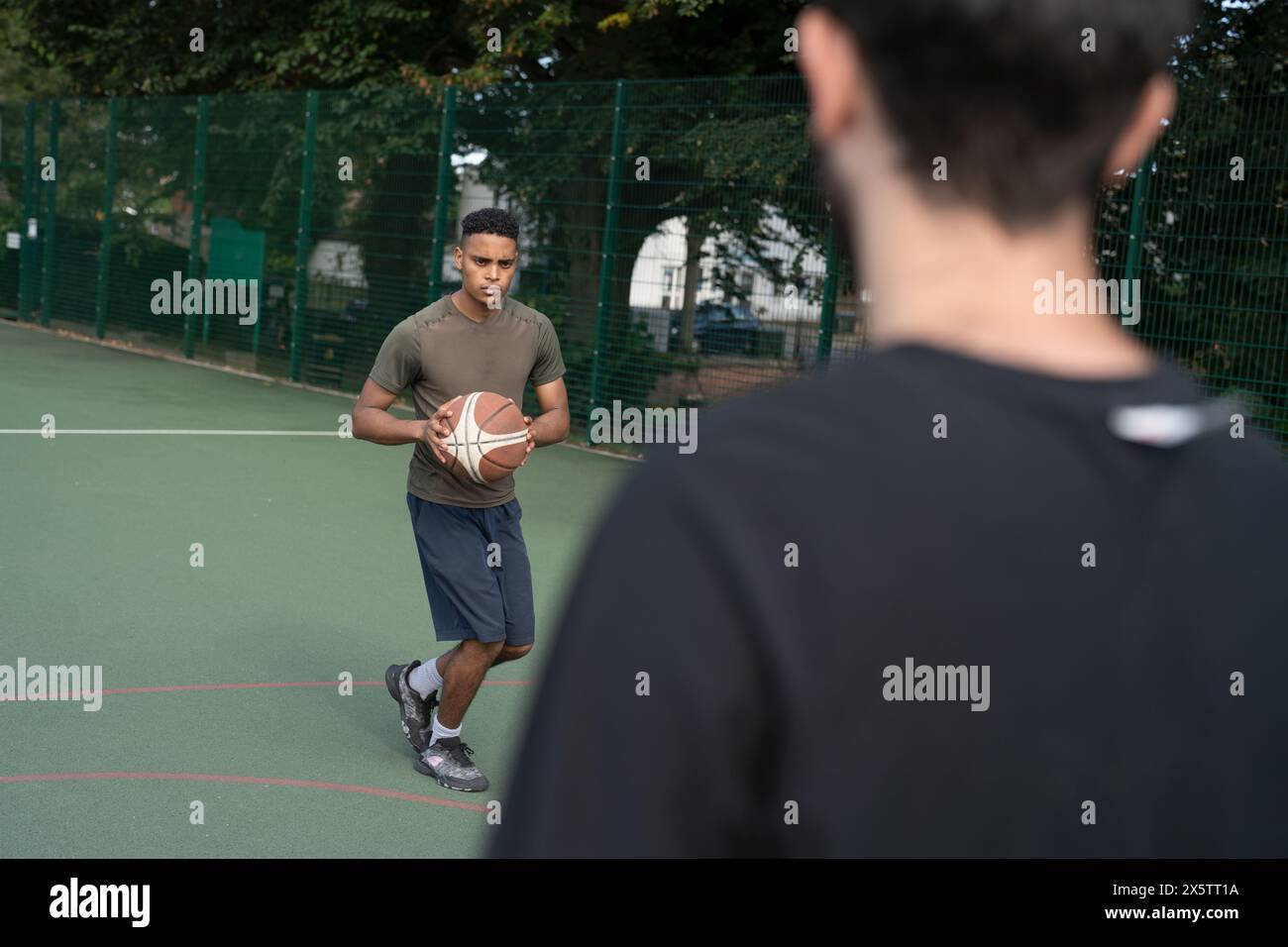 Two men playing outdoor basketball hi-res stock photography and images ...