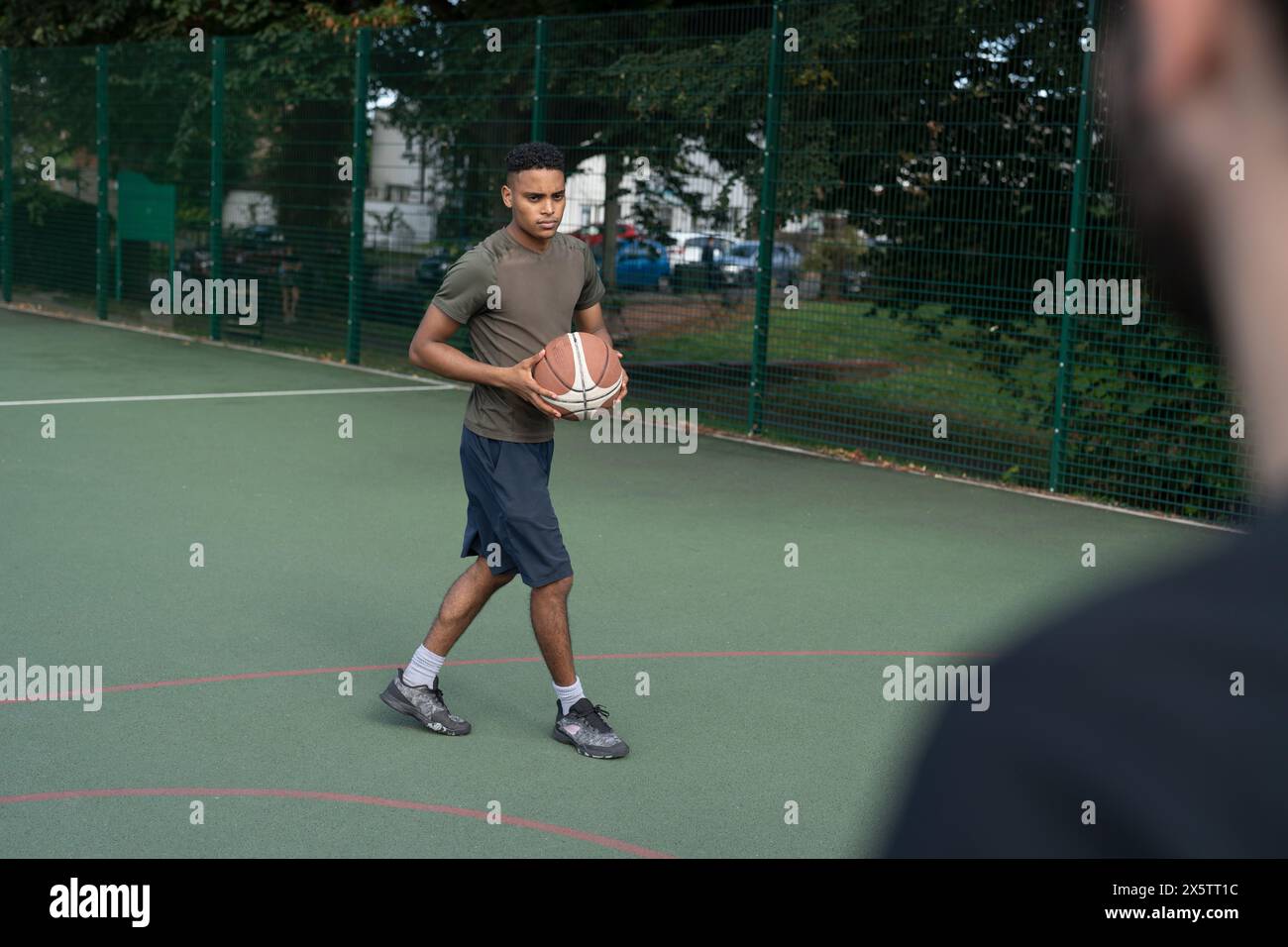 Two men playing outdoor basketball hi-res stock photography and images ...
