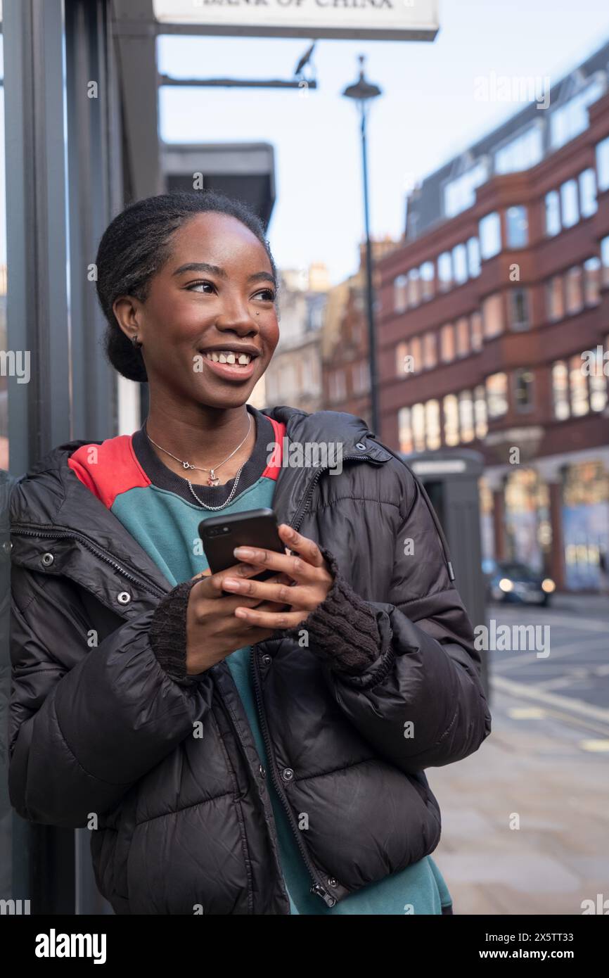 Black african woman waiting bus hi-res stock photography and images - Alamy