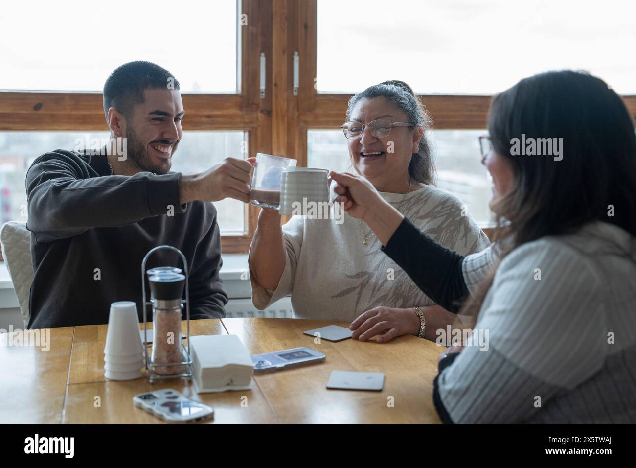 Three-generation family drinking tea at home Stock Photo - Alamy