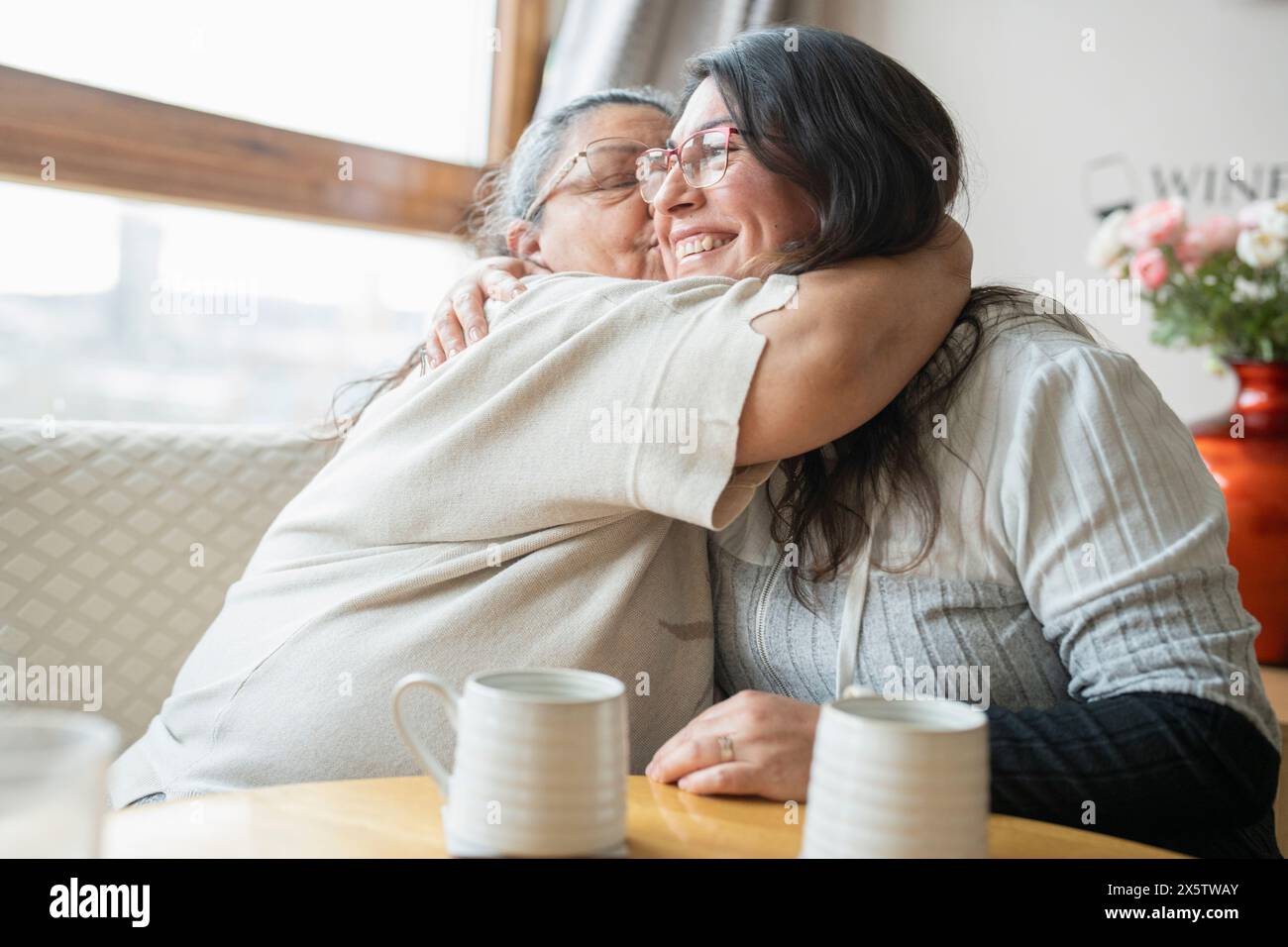 Two senior women hugging hi-res stock photography and images - Alamy