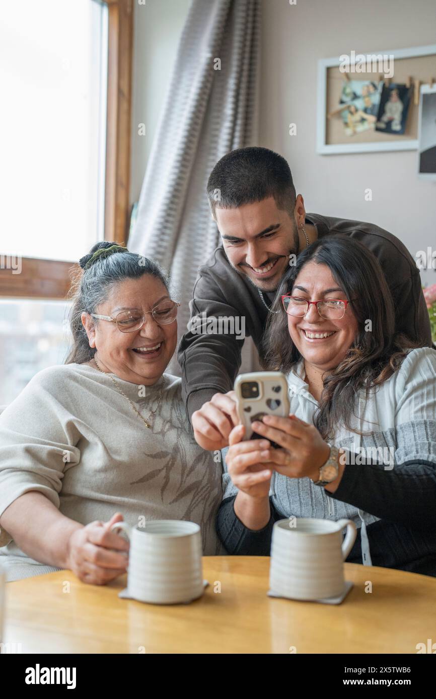 Three-generation family taking selfie at home Stock Photo - Alamy