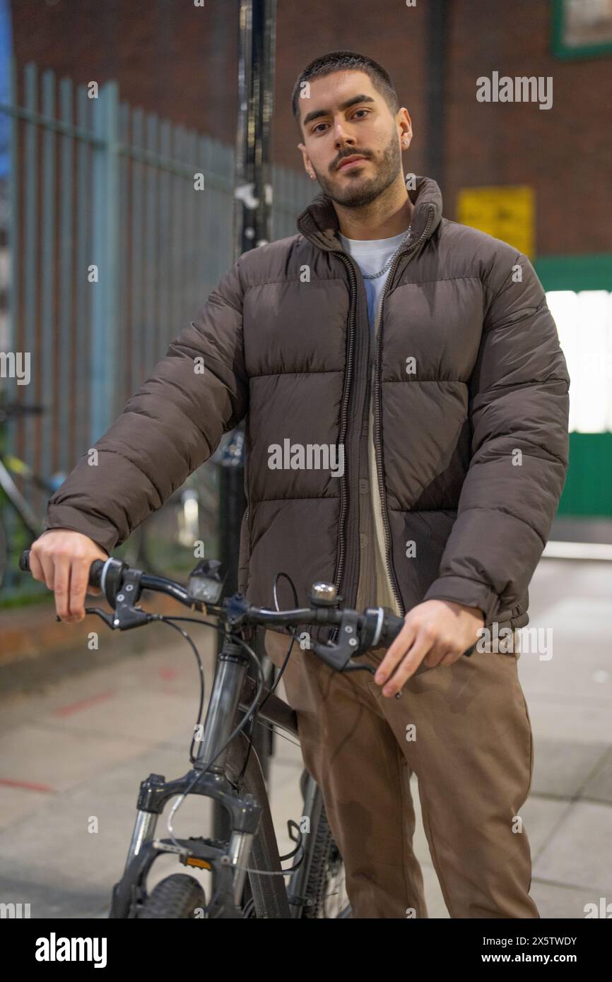 Handsome young man bicycle hi-res stock photography and images - Alamy
