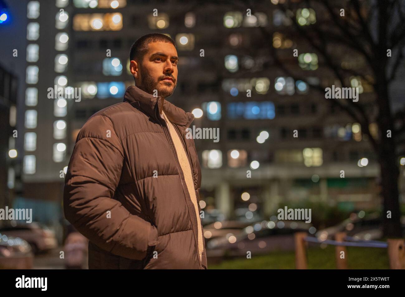 Man standing night in beige hi-res stock photography and images - Alamy