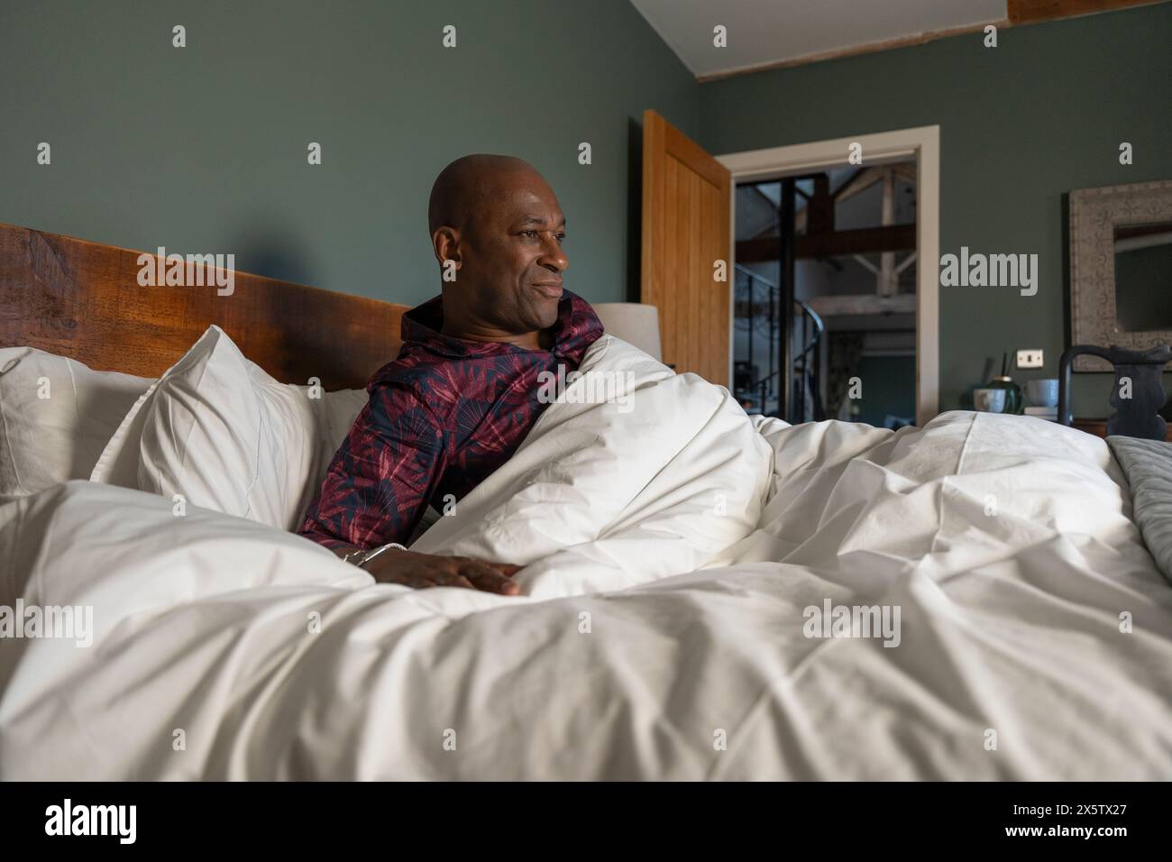 View of man in bed after waking up Stock Photo - Alamy