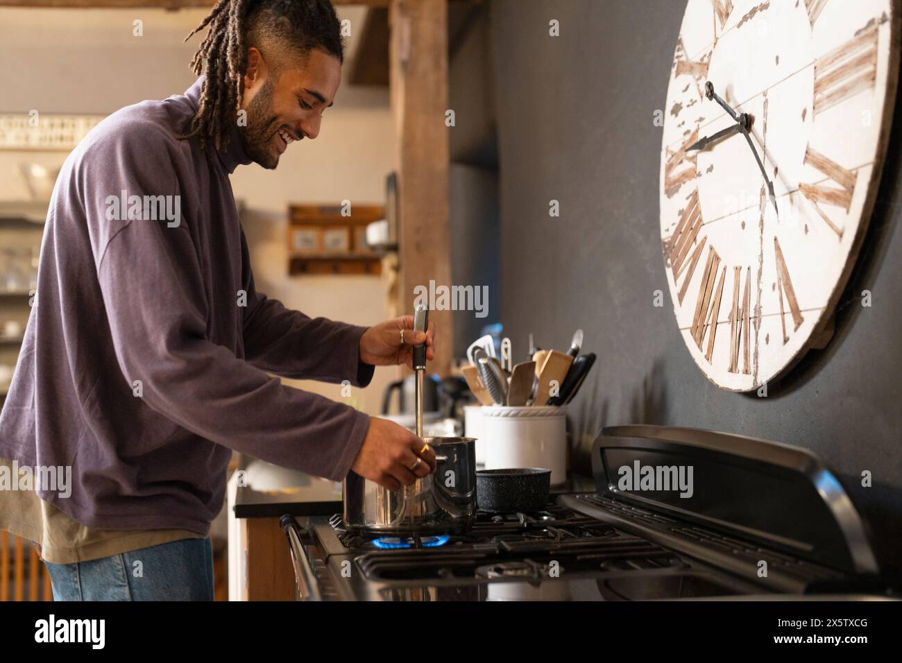 Man at stove hi-res stock photography and images - Alamy