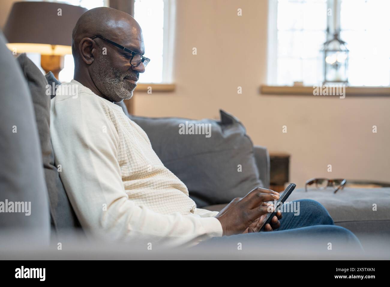 Sitting senior man using hi-res stock photography and images - Alamy