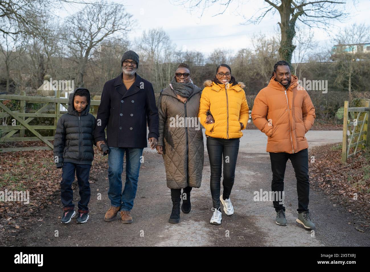 Three generation family walking together in rural area Stock Photo - Alamy
