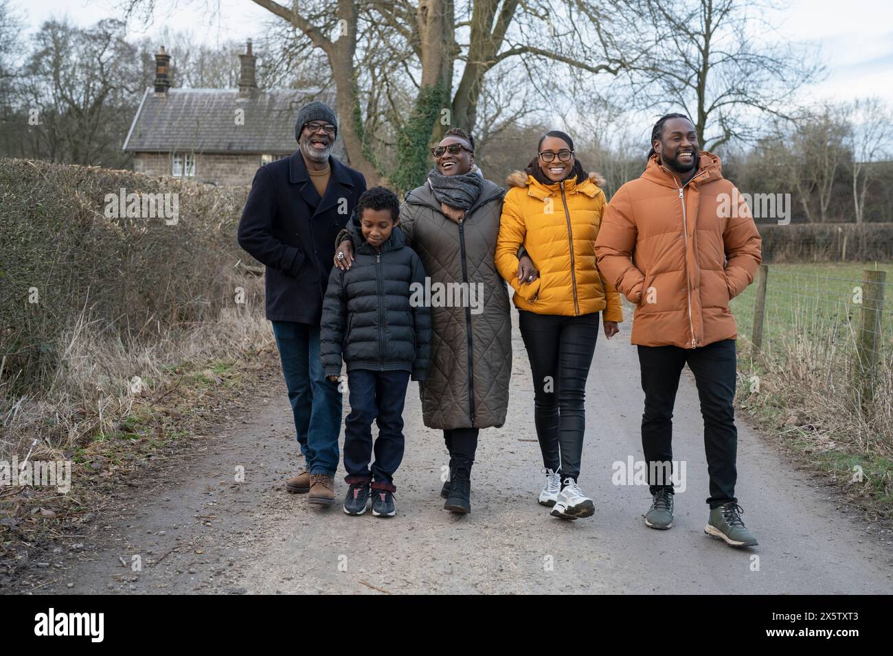 Three generation family walking together in rural area Stock Photo - Alamy