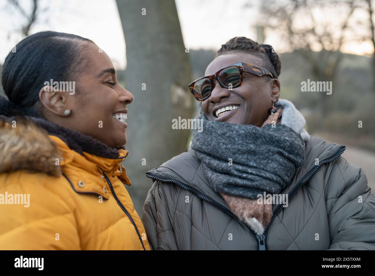 Two women posing in rural setting Stock Photo - Alamy
