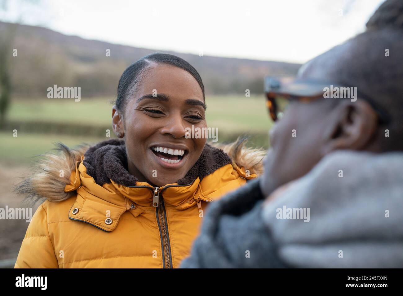 Two women laughing in rural setting Stock Photo - Alamy