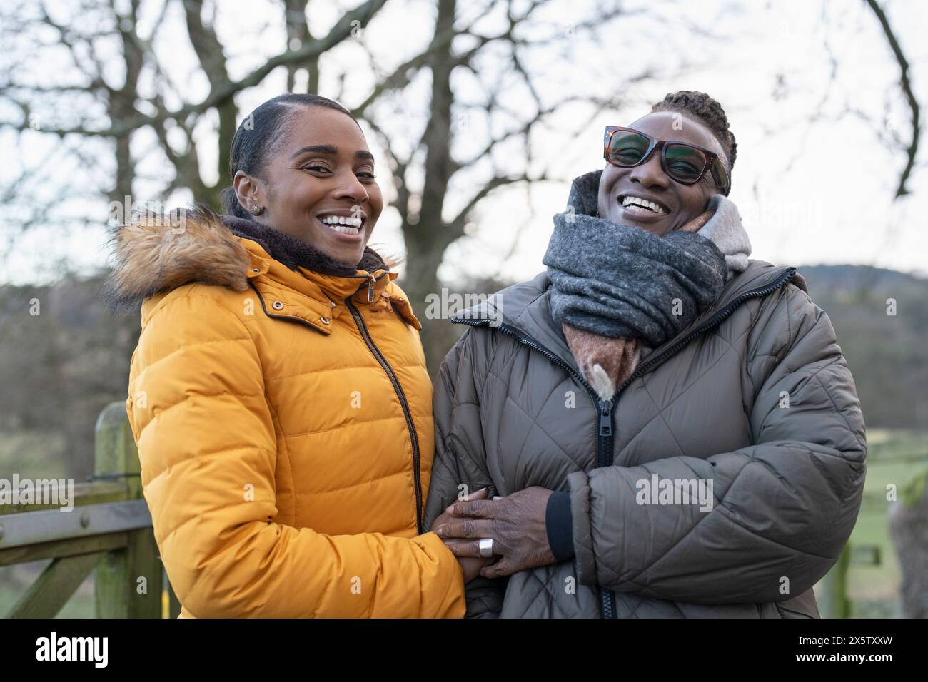 Two women posing in rural setting Stock Photo - Alamy
