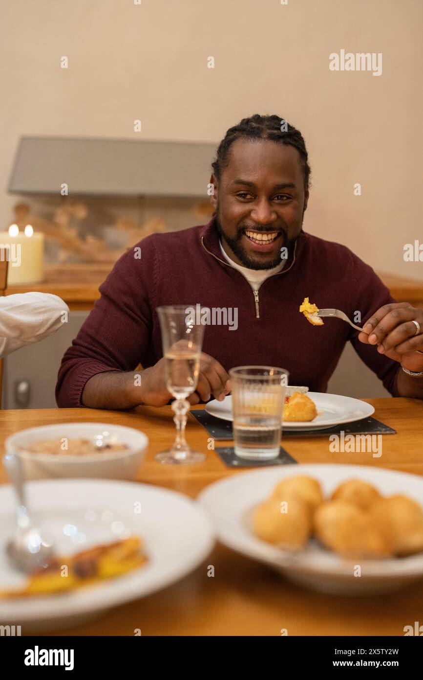 Man eating dinner at home Stock Photo - Alamy