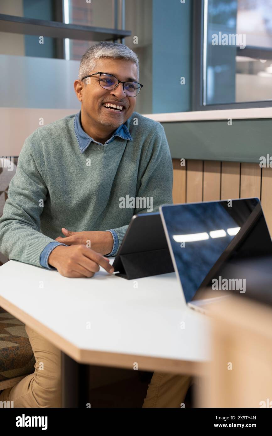 Smiling adult businessman working hi-res stock photography and images ...