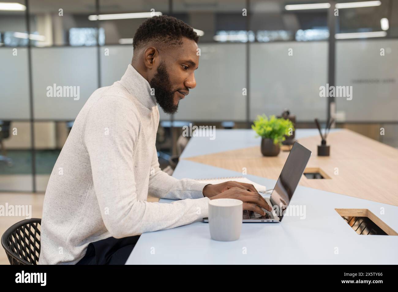 Young employee working in office hi-res stock photography and images ...