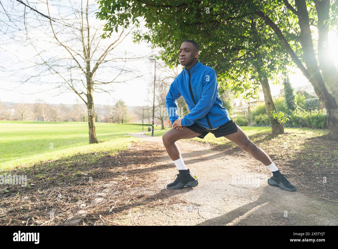 Athlete stretching legs on hi-res stock photography and images - Alamy