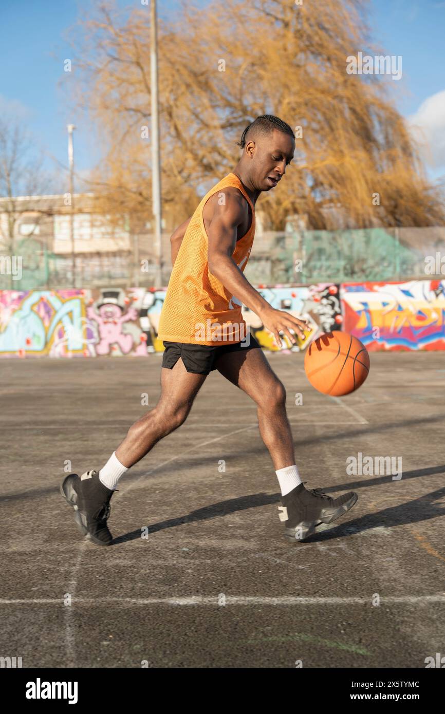 Active african man bouncing ball hi-res stock photography and images ...