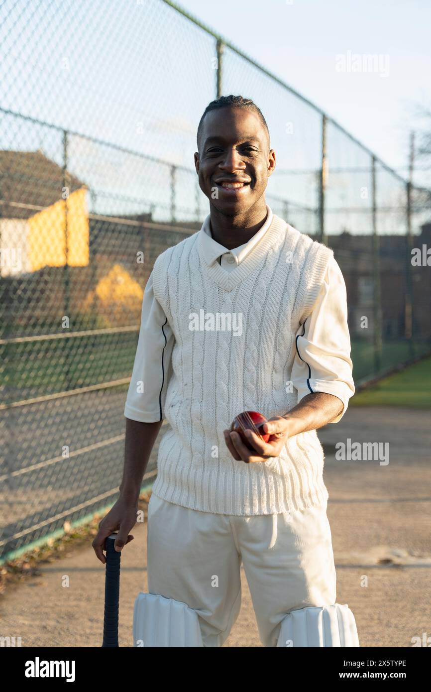 Portrait cricketer holding bat hi-res stock photography and images - Alamy