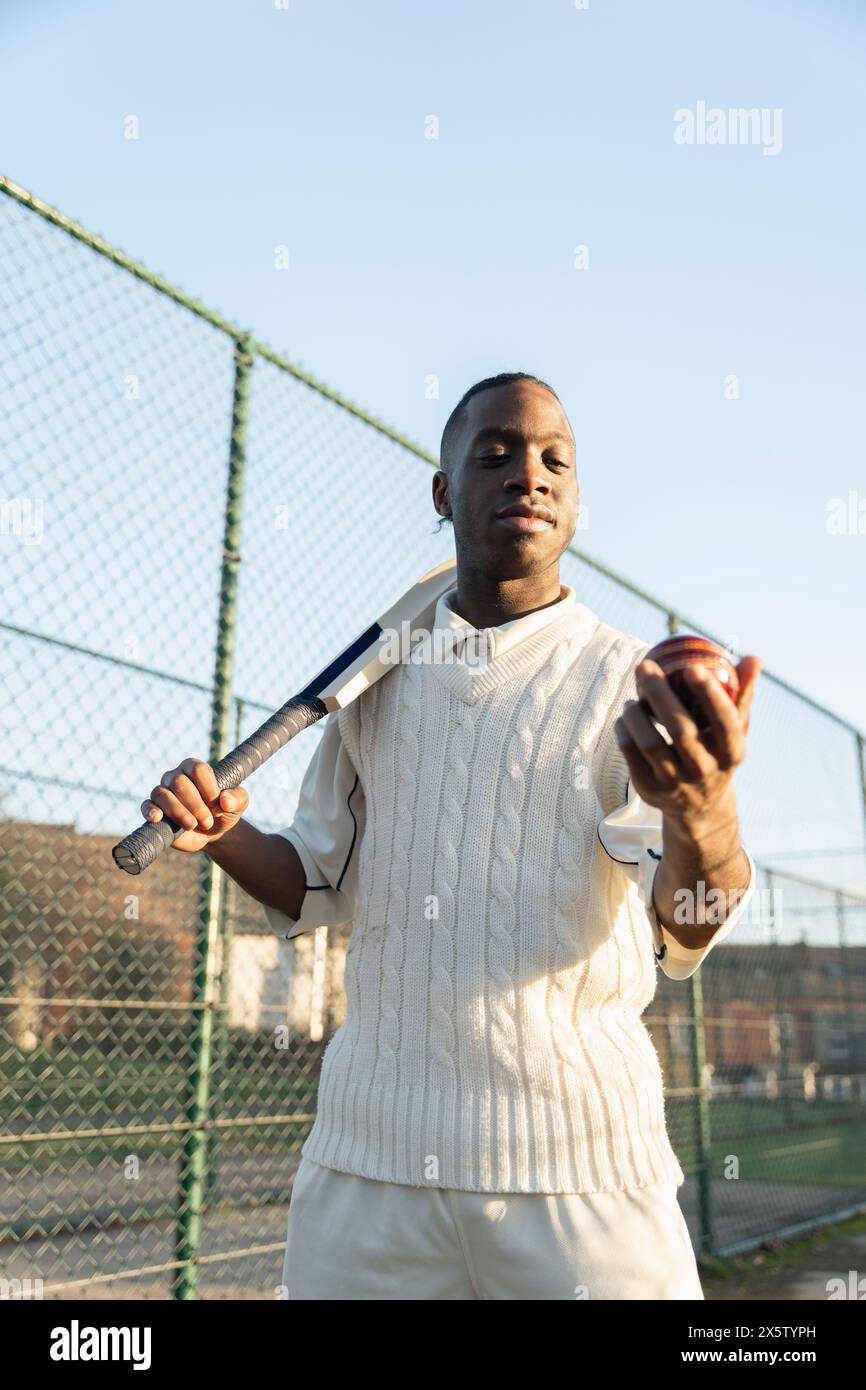 Portrait cricketer holding bat hi-res stock photography and images - Alamy