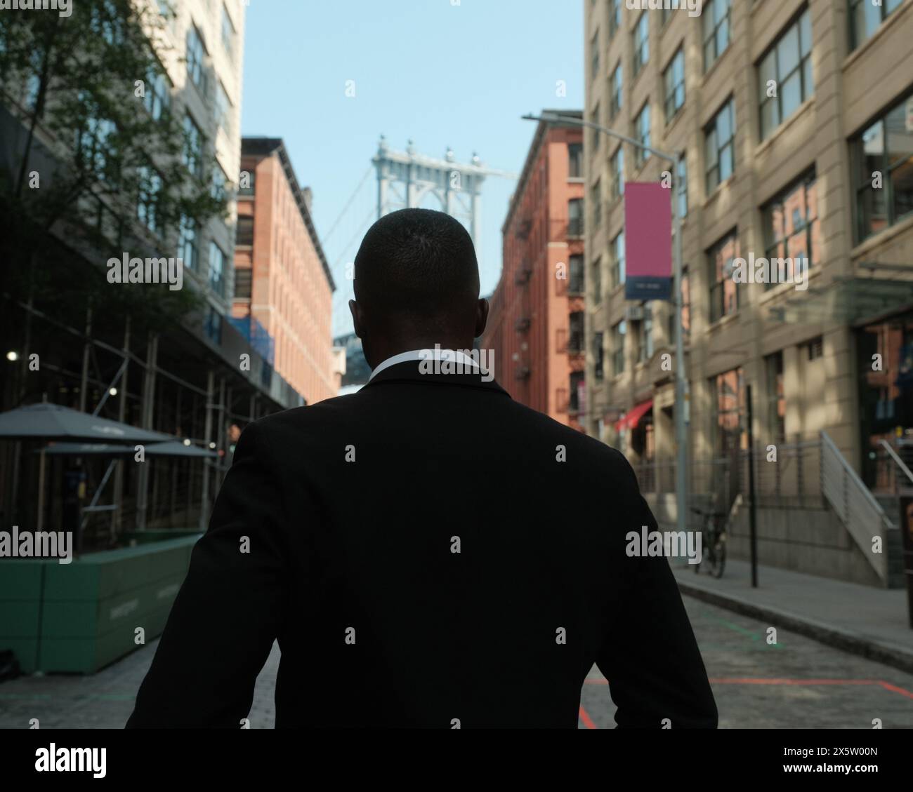 Young man standing in the street hi-res stock photography and images ...