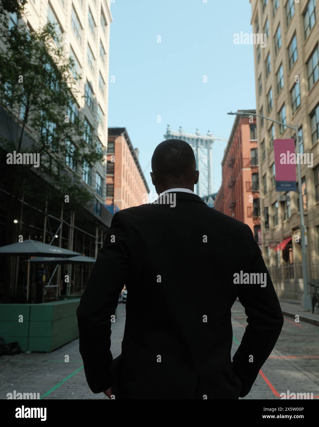 USA, New York City, Rear view of man in suit standing on street Stock Photo - Alamy