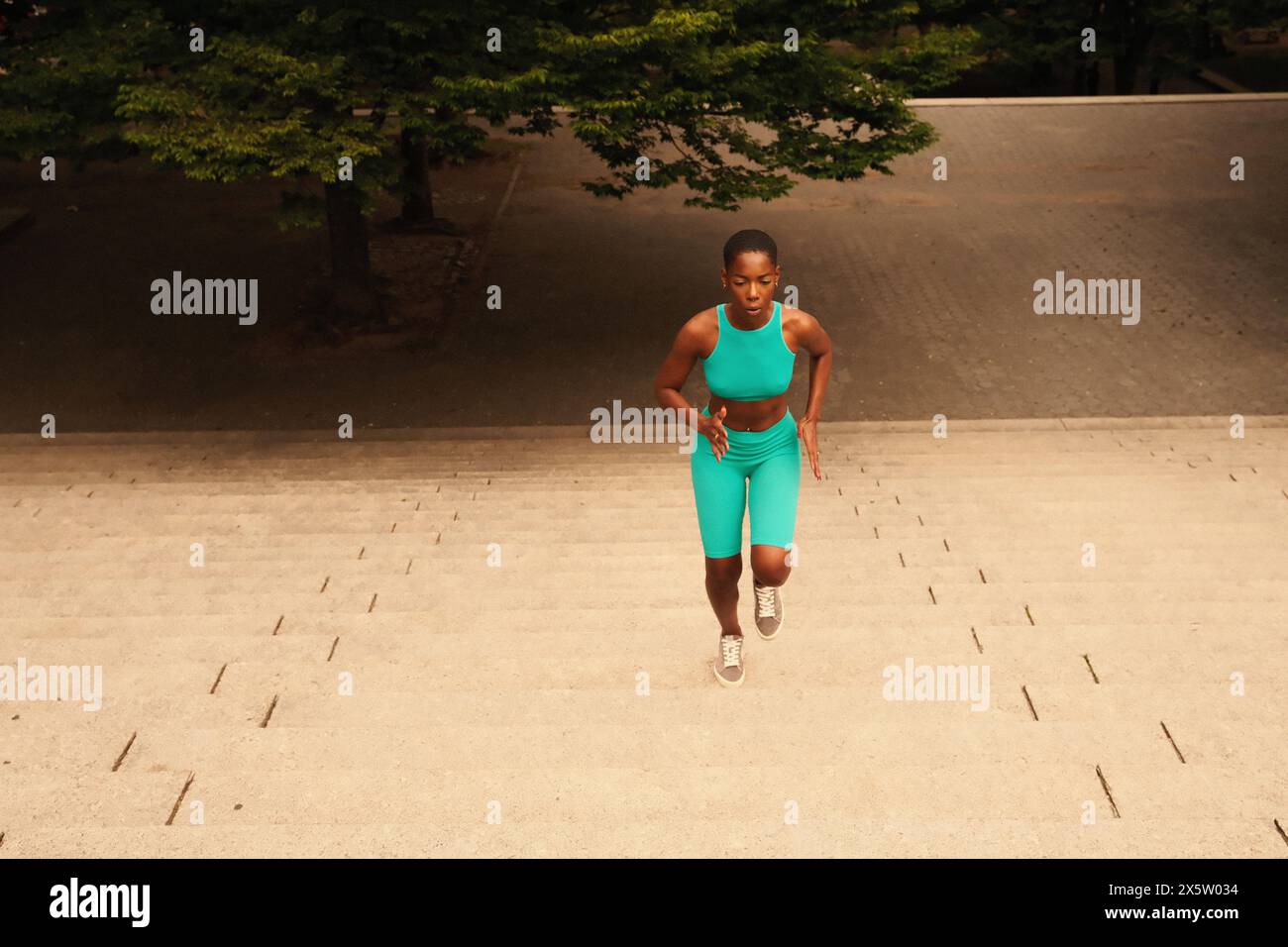 Woman up steps hi-res stock photography and images - Alamy