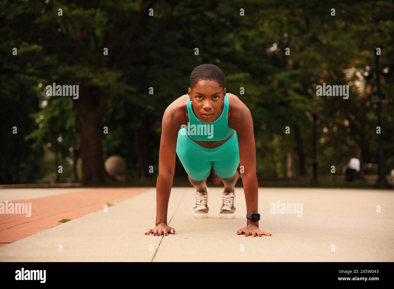 Woman doing push ups in the park hi-res stock photography and images ...
