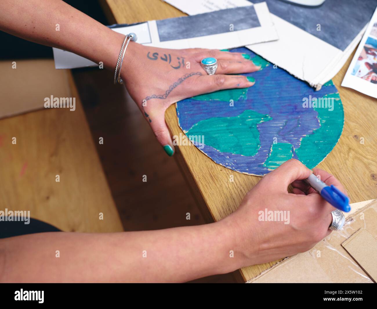 Woman making environmental paper sign Stock Photo - Alamy