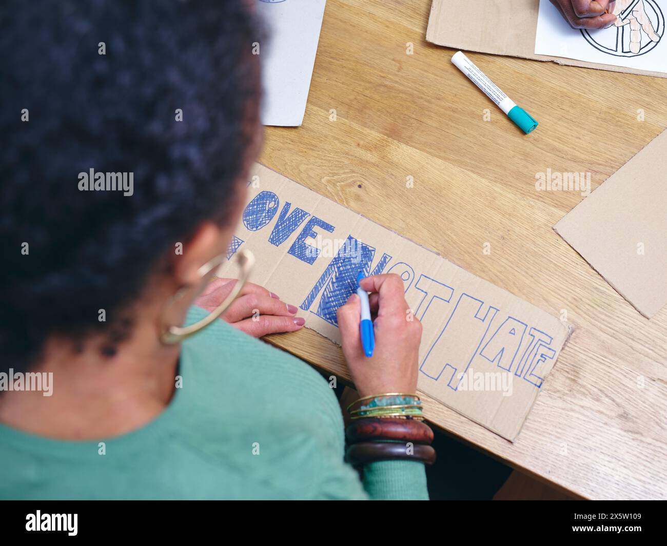 Woman making protest signs with symbols of peace Stock Photo - Alamy
