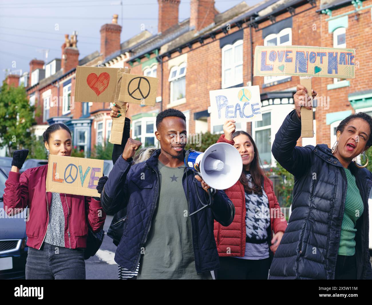 People on street holding protest signs with symbols of peace Stock ...