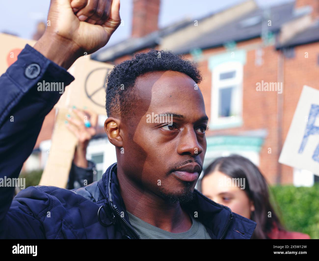 Protestor with hand raised Stock Photo - Alamy