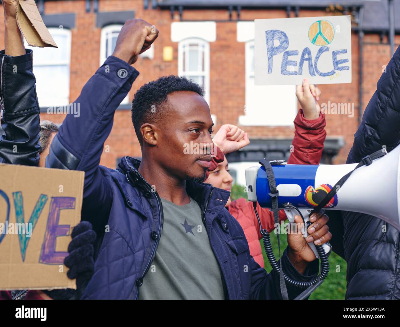 People on street holding protest signs with symbols of peace Stock ...
