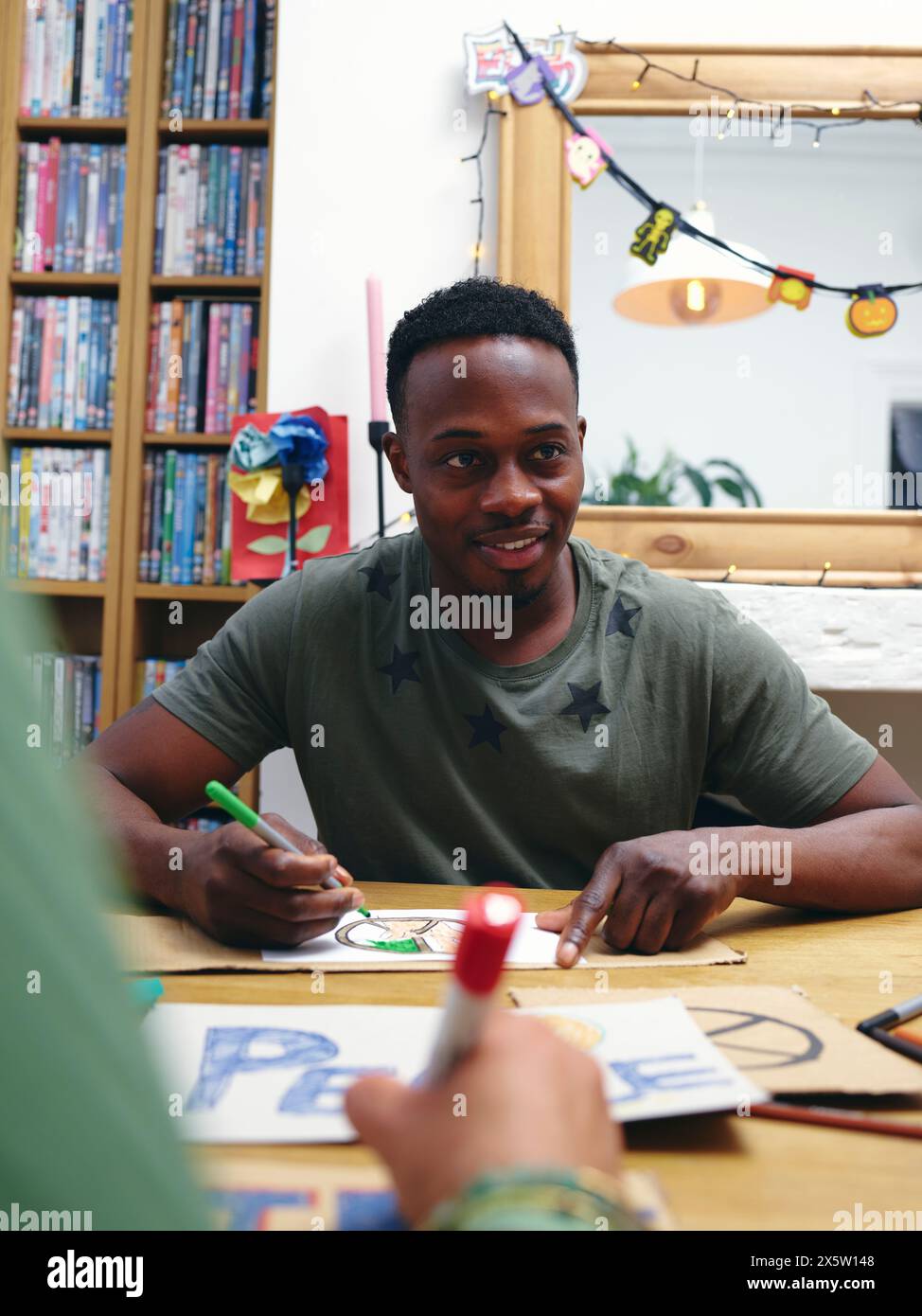 People sitting in room and making protest signs Stock Photo - Alamy